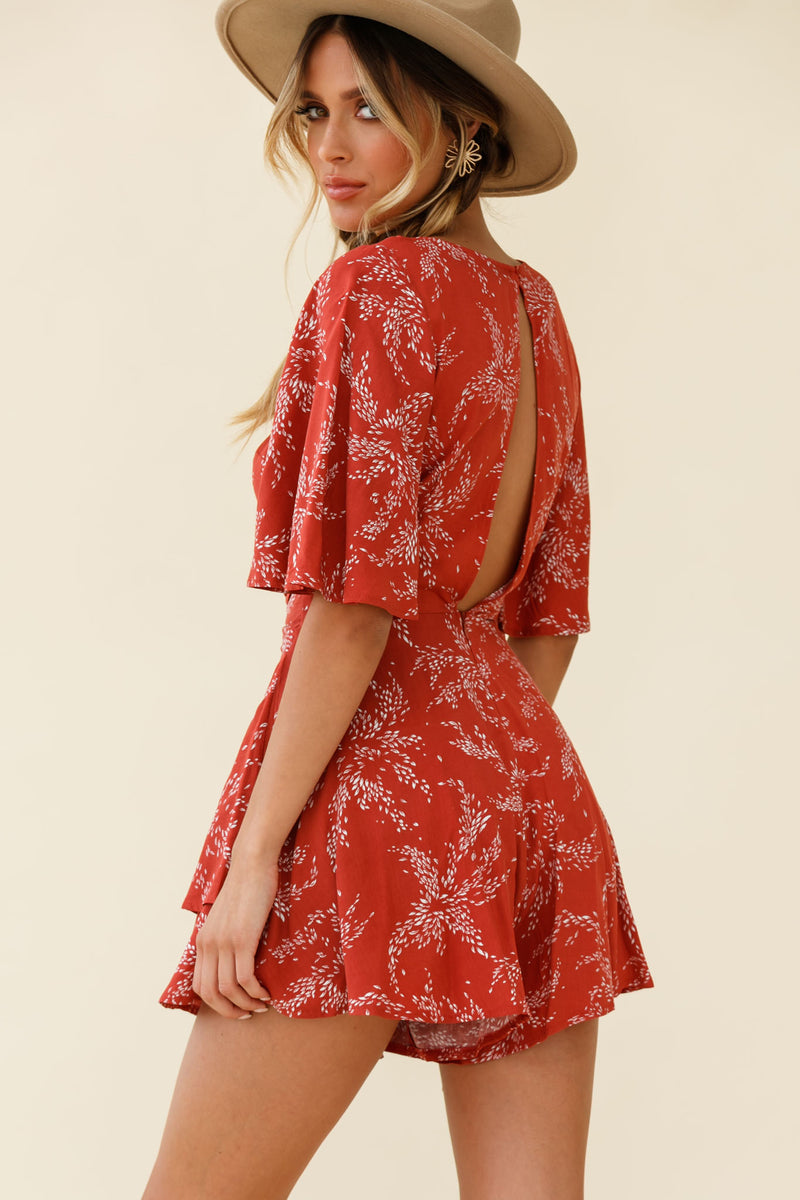 Shop the Davina Angel Sleeve Cut-Out Back Romper Leaf Print Rose